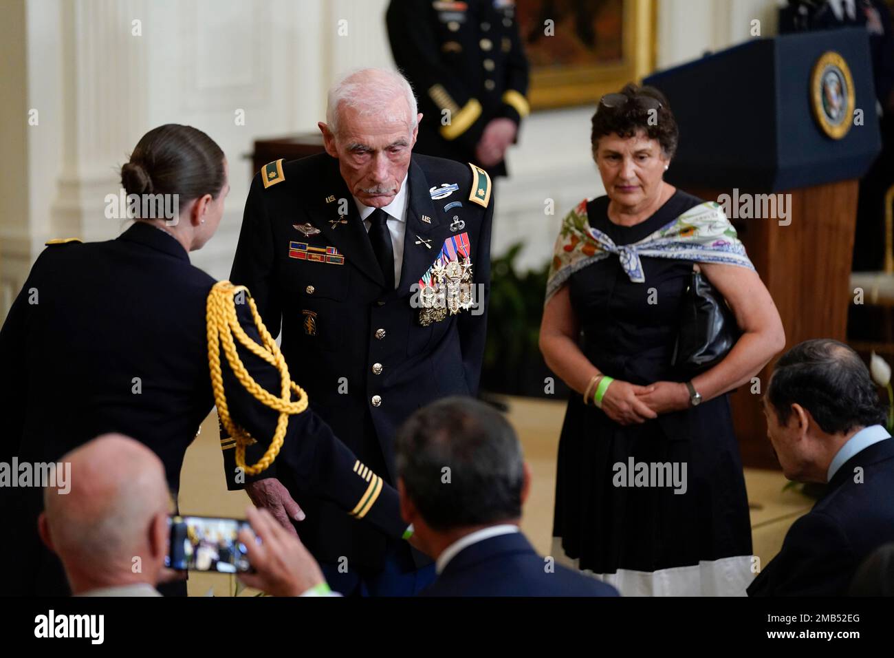 Retired Maj. John Duffy arrives for a ceremony in the East Room of the ...
