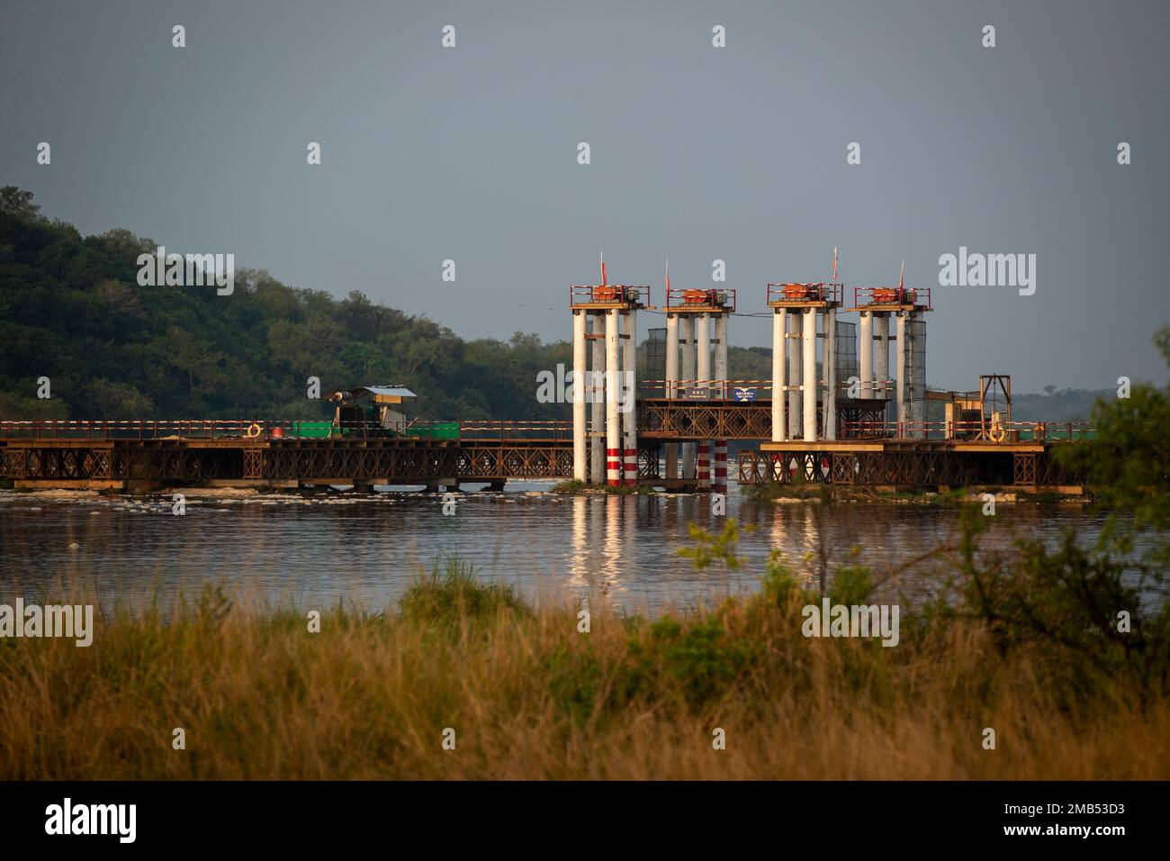 A new bridge over the Nile river in the process of being constructed is ...