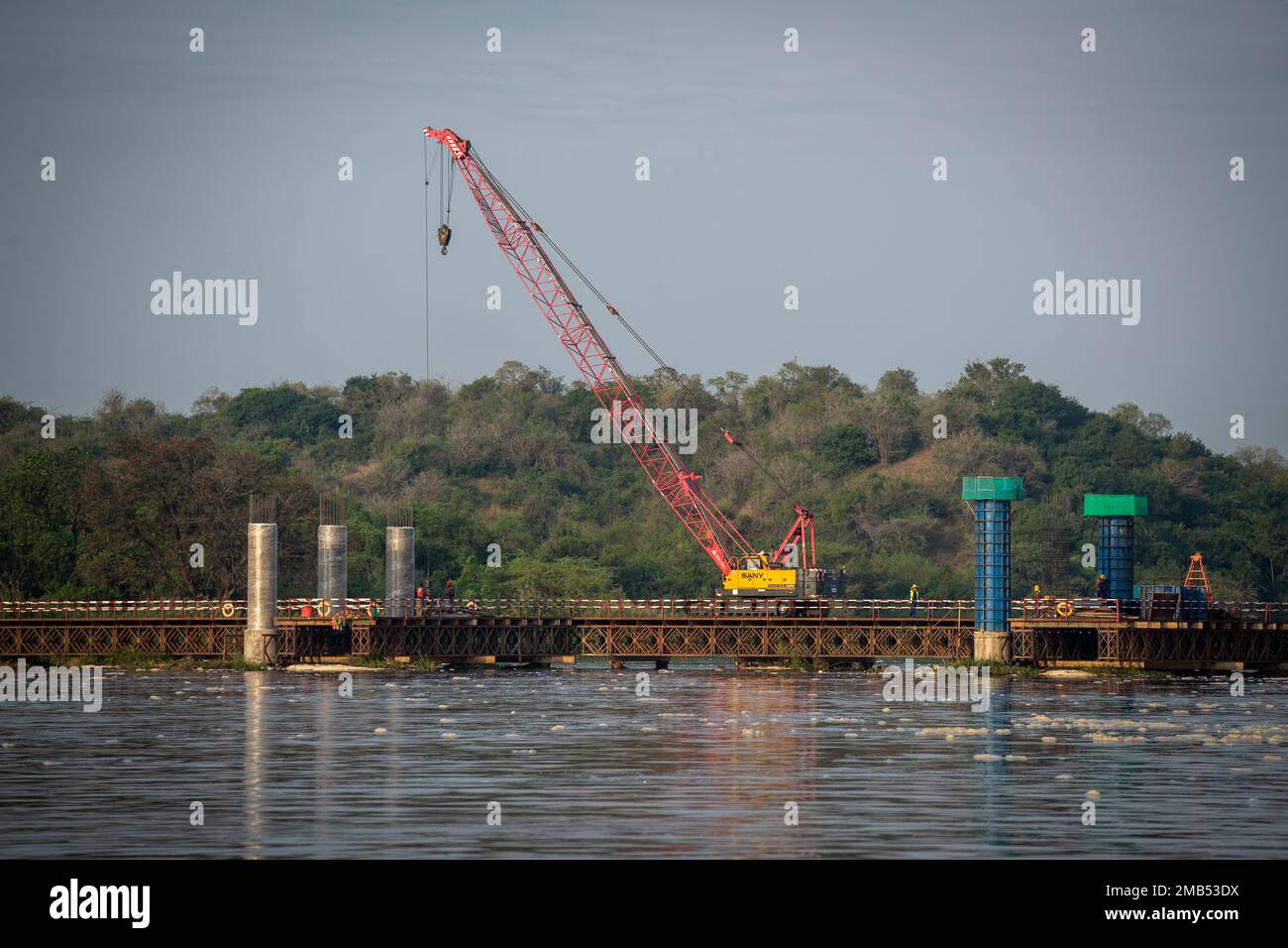 A new bridge over the Nile river in the process of being constructed is ...