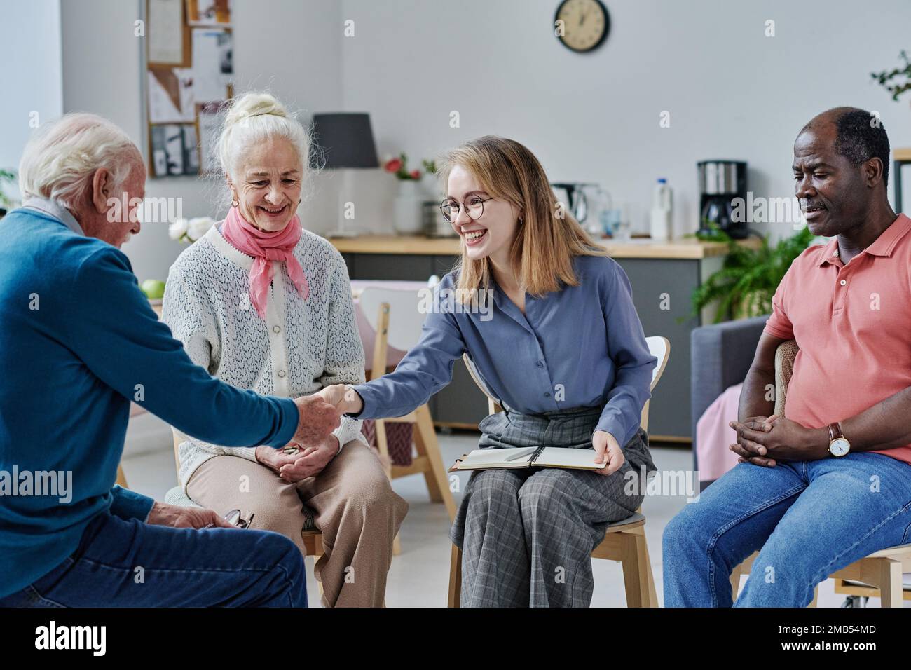 African american caregiver greeting senior hi-res stock photography and ...