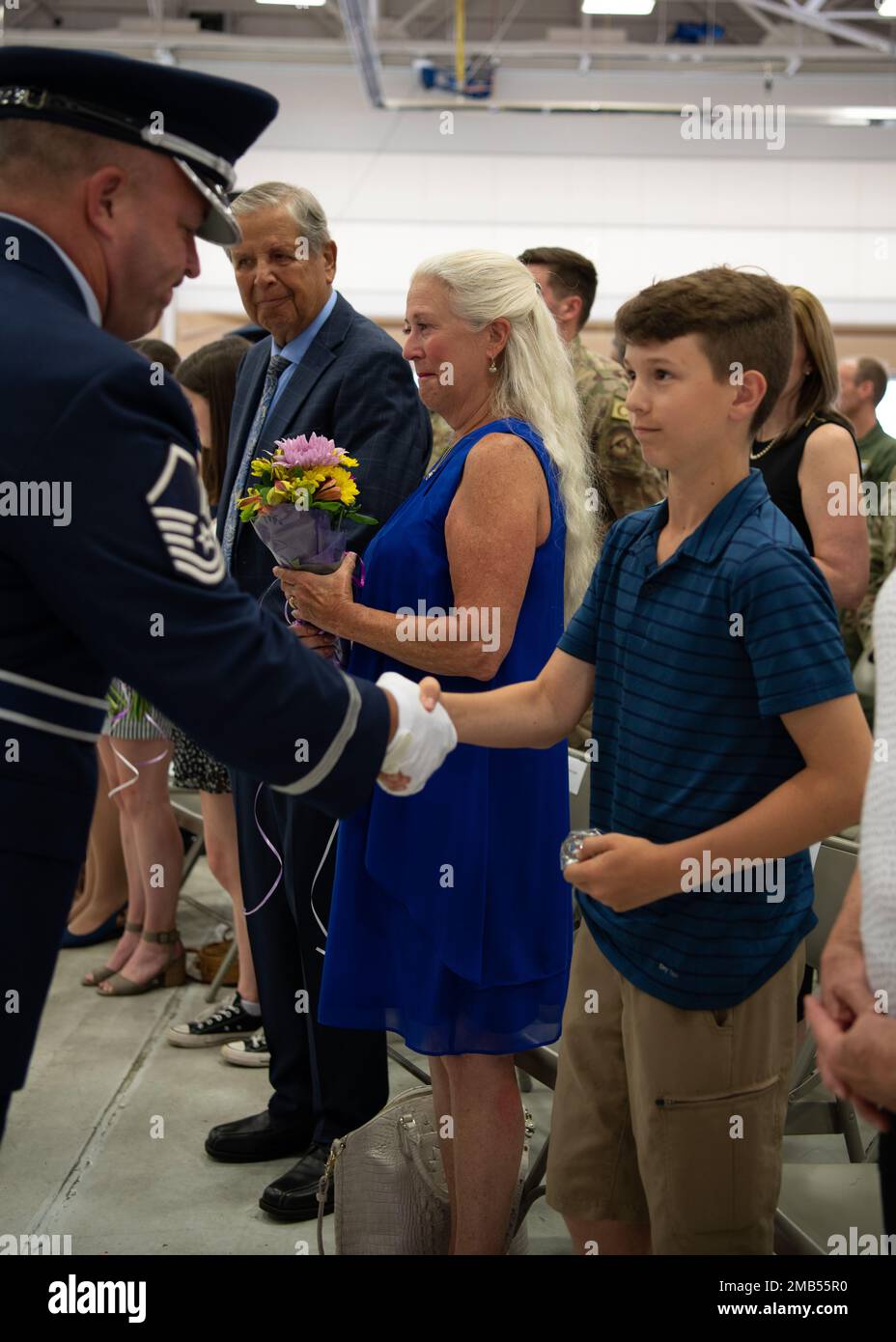 104th Fighter Wing honor guard members bring forward bouquets of ...