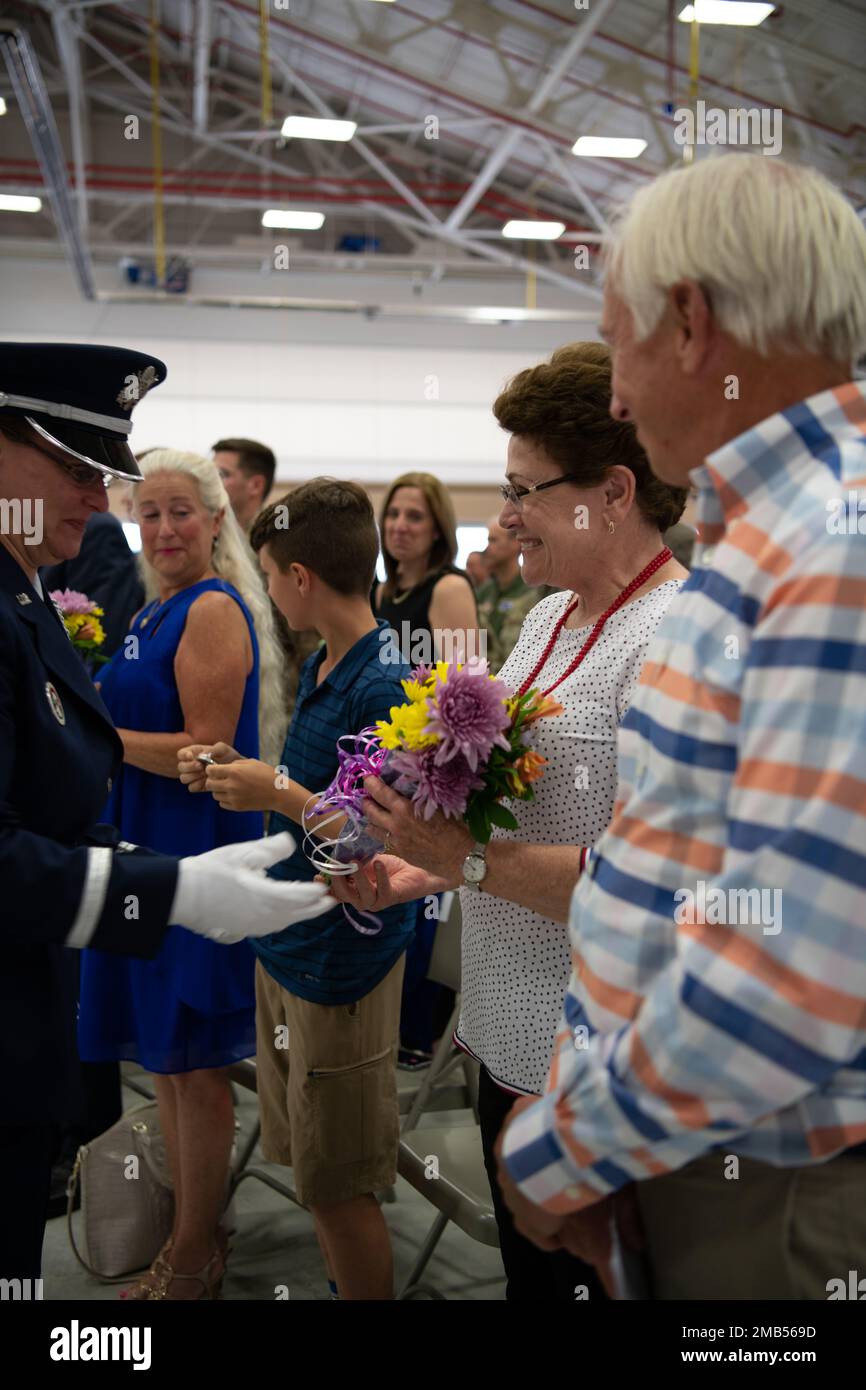 104th Fighter Wing honor guard members bring forward bouquets of ...