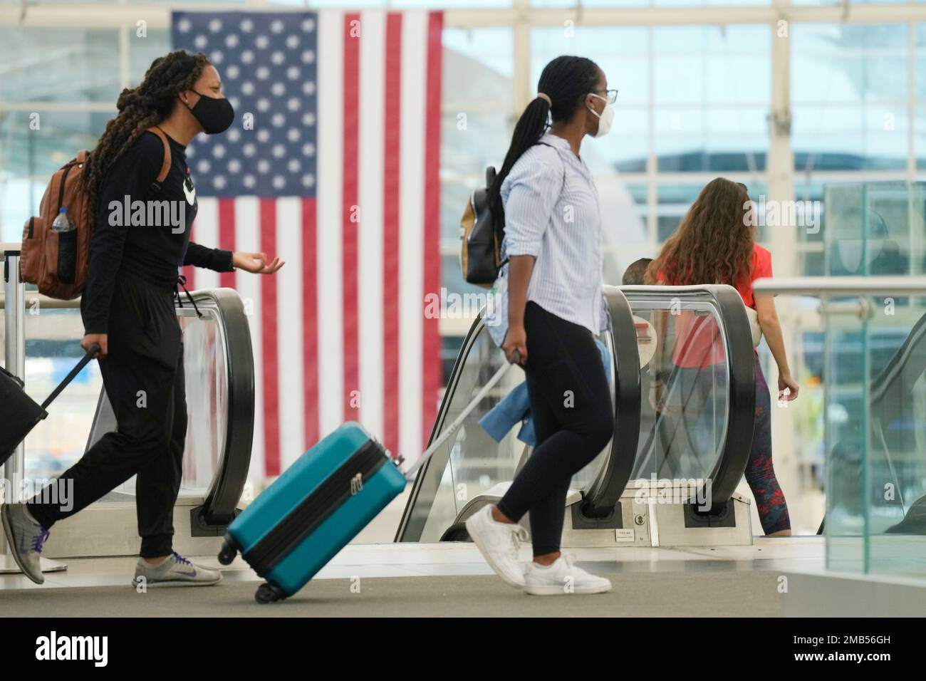 Travelers head to the south security checkpoint at a terminal of Denver ...