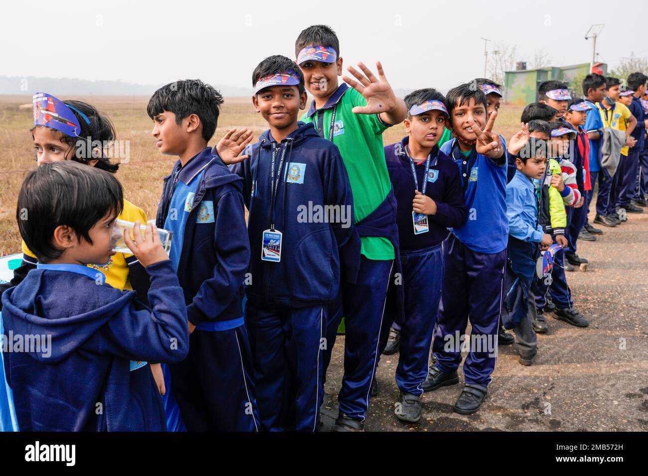 Children watch an aerobatic aerial display at the Air Force station in ...