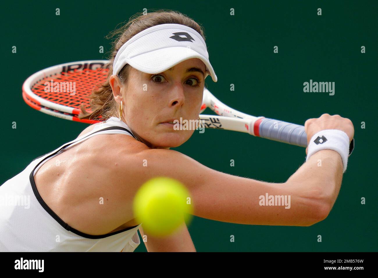 France's Alize Cornet eyes the ball during a women's singles fourth ...