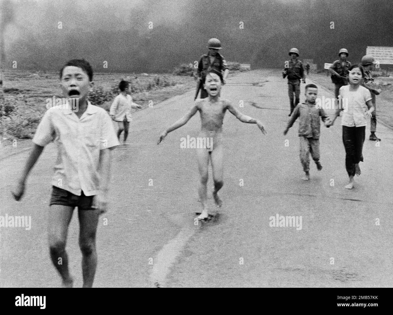 FILE - 9-year-old Kim Phuc, center, runs with her brothers and cousins, followed by South ...