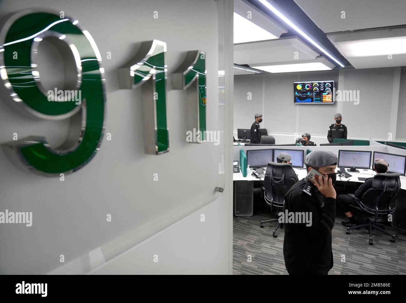 Saudi policemen work at the the Saudi National Center for Security ...