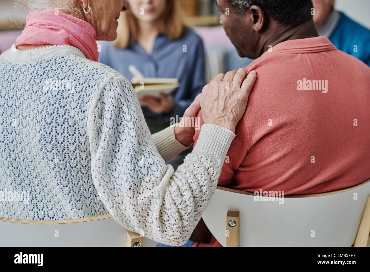 Rear view of senior people learning to support each other during ...