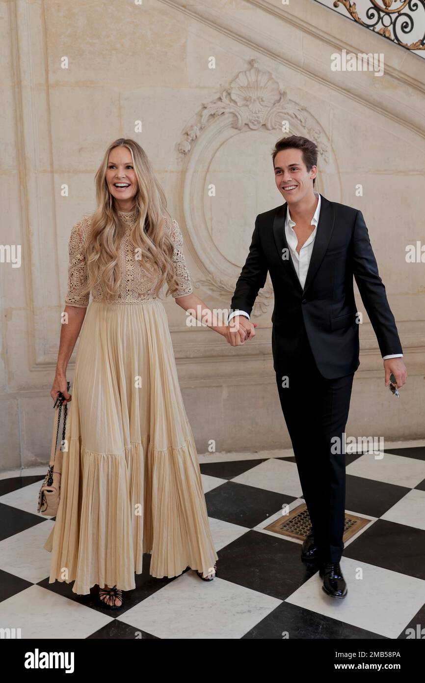 Elle Macpherson, left, and Flynn Busson, pose for photographers upon ...