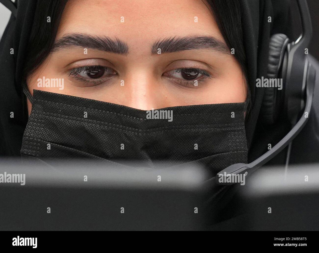 Saudi police woman Samah Mohammed receives calls at the Saudi National ...