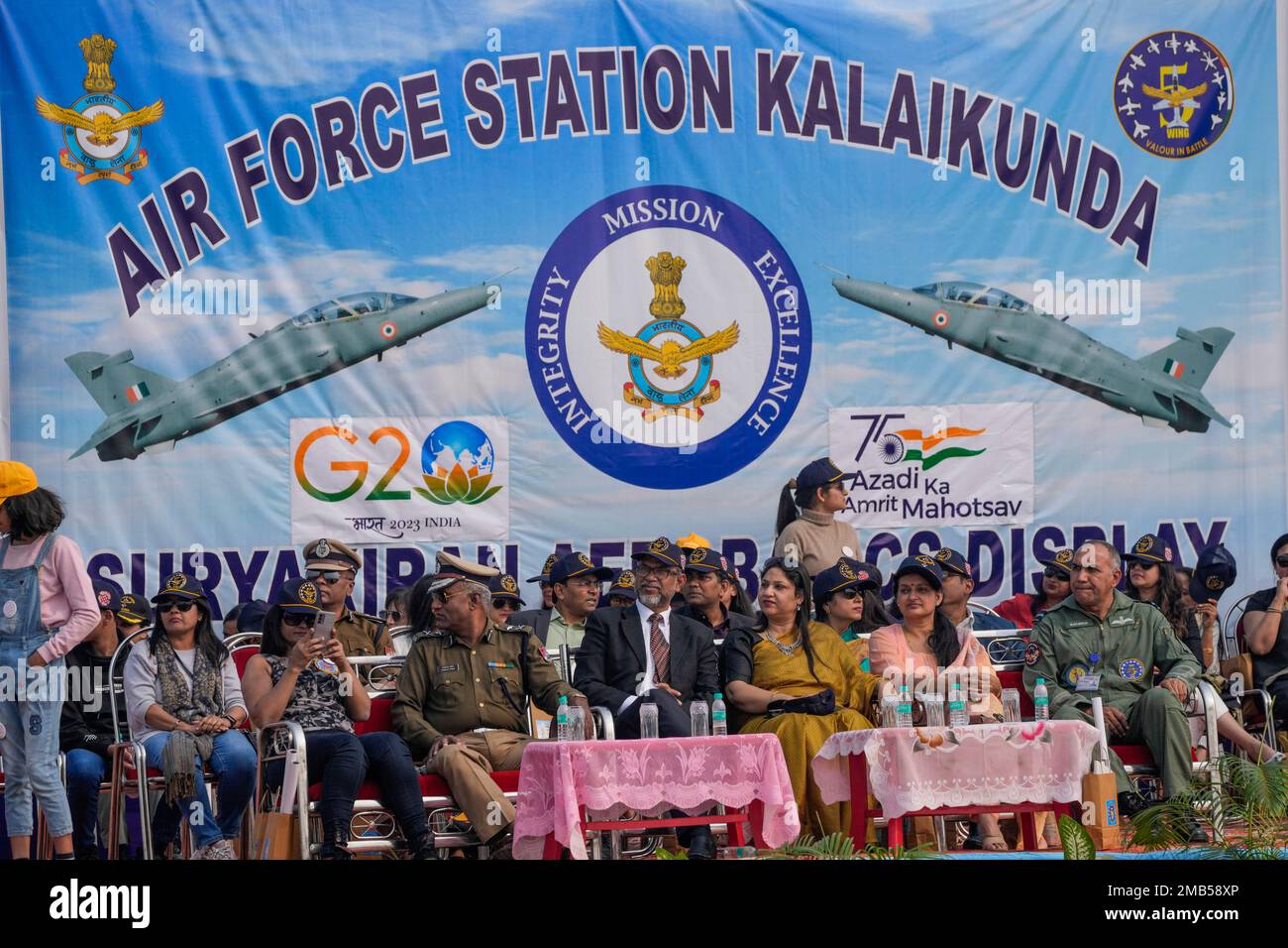 people watch an aerobatic aerial display at the Air Force station in ...