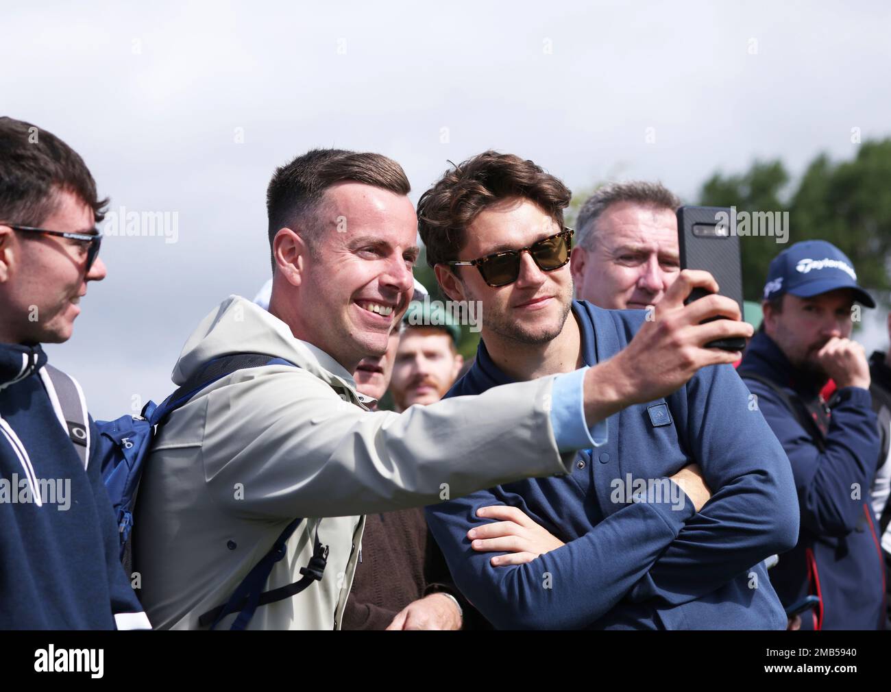 Singer and songwriter Niall Horan takes a picture with fans during the ...