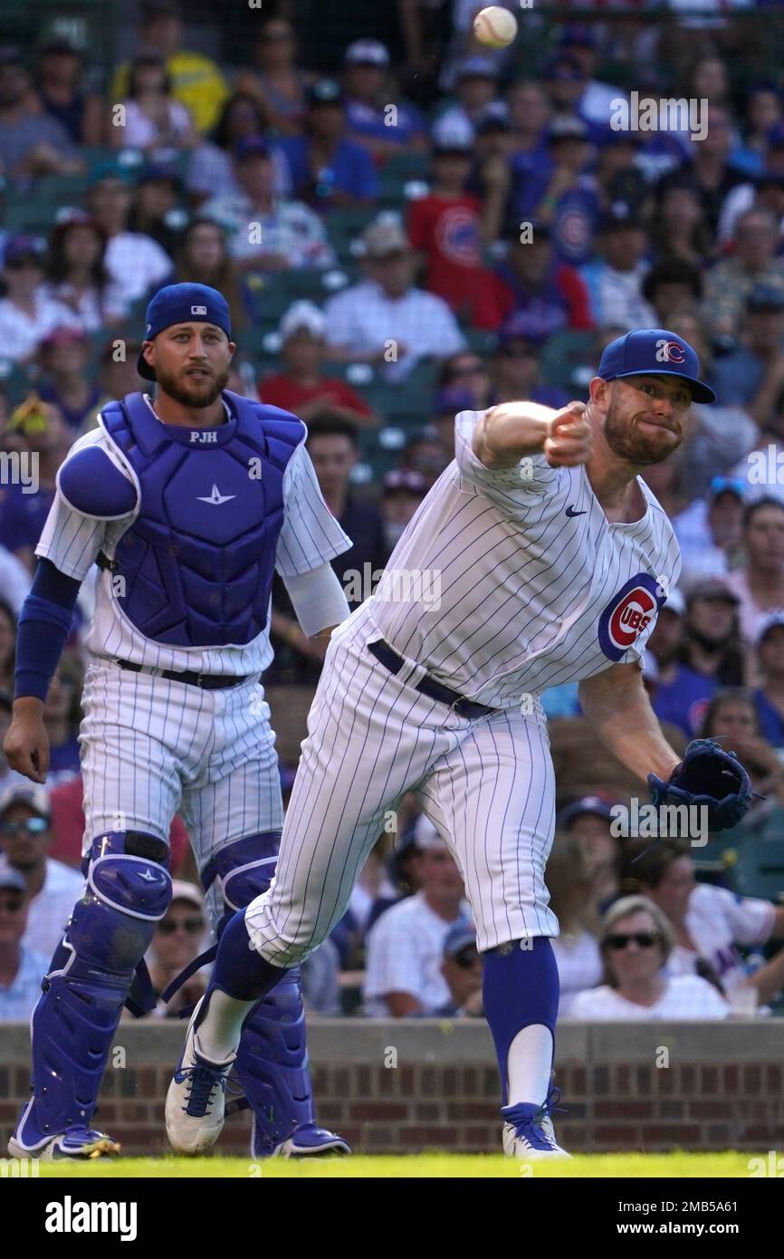 Chicago Cubs relief pitcher Rowan Wick, right, makes a two-run throwing ...