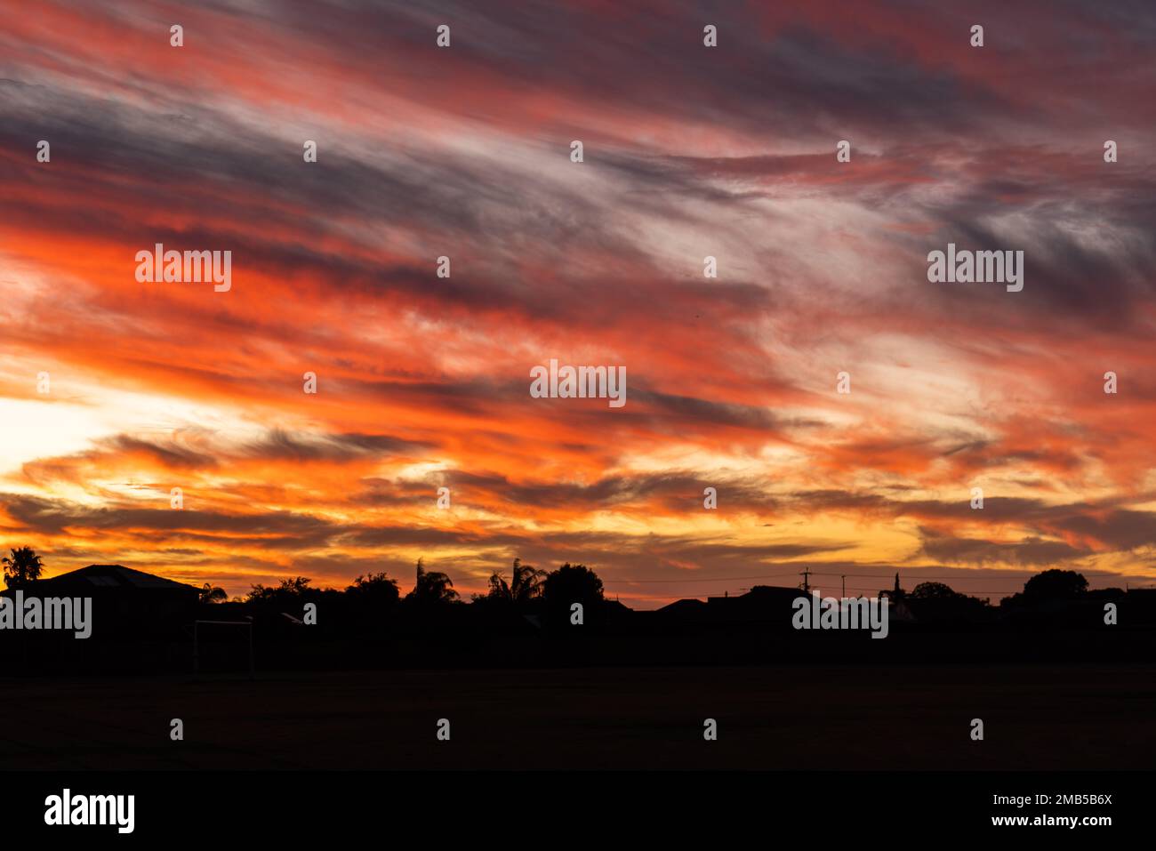 Firesky sunset with orange and red coloured clouds Stock Photo - Alamy