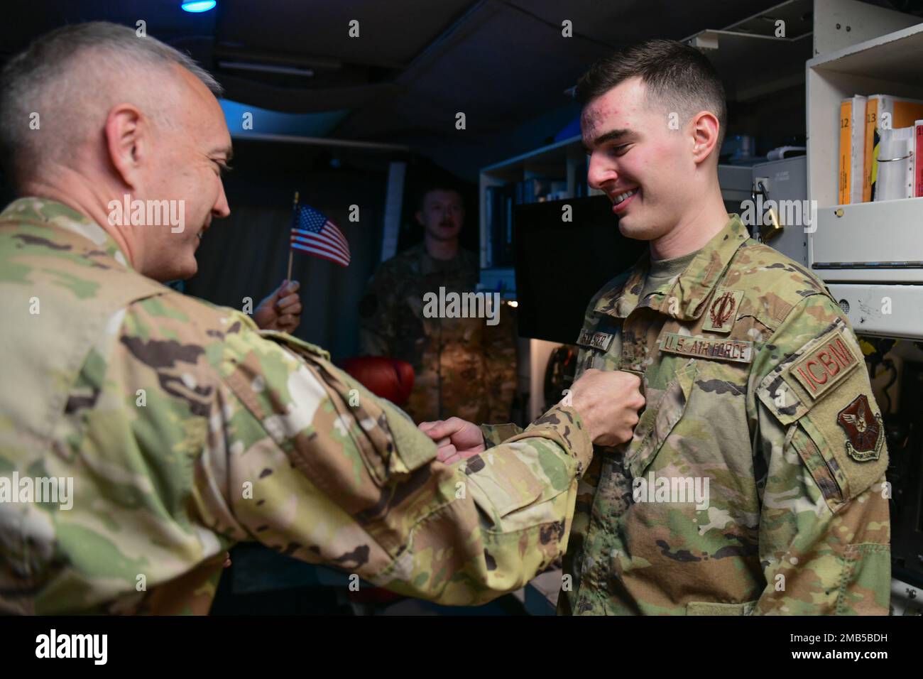 Col. Barry Little, vice commander of the 20th Air Force, pins the ...