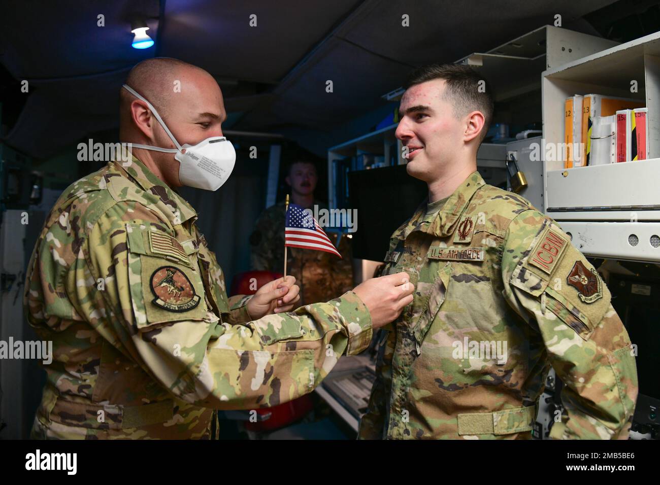1st Lt. Cody Swift, missileer with the 320th Missile Squadron, pins the ...