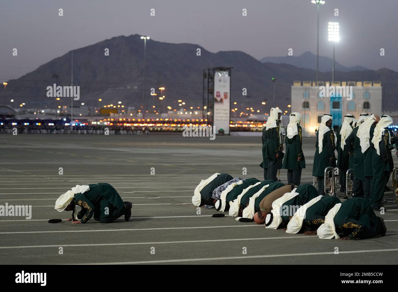 Members of the Saudi special forces pray before a military parade in ...