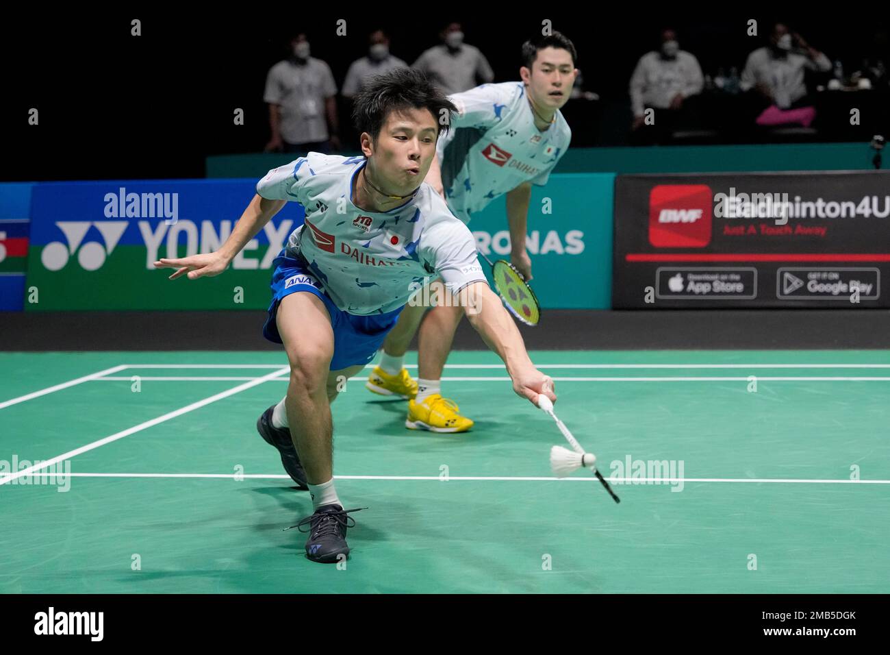Japan's Takuro Hoki, rear, and Yugo Kobayashi play against Indonesia's ...