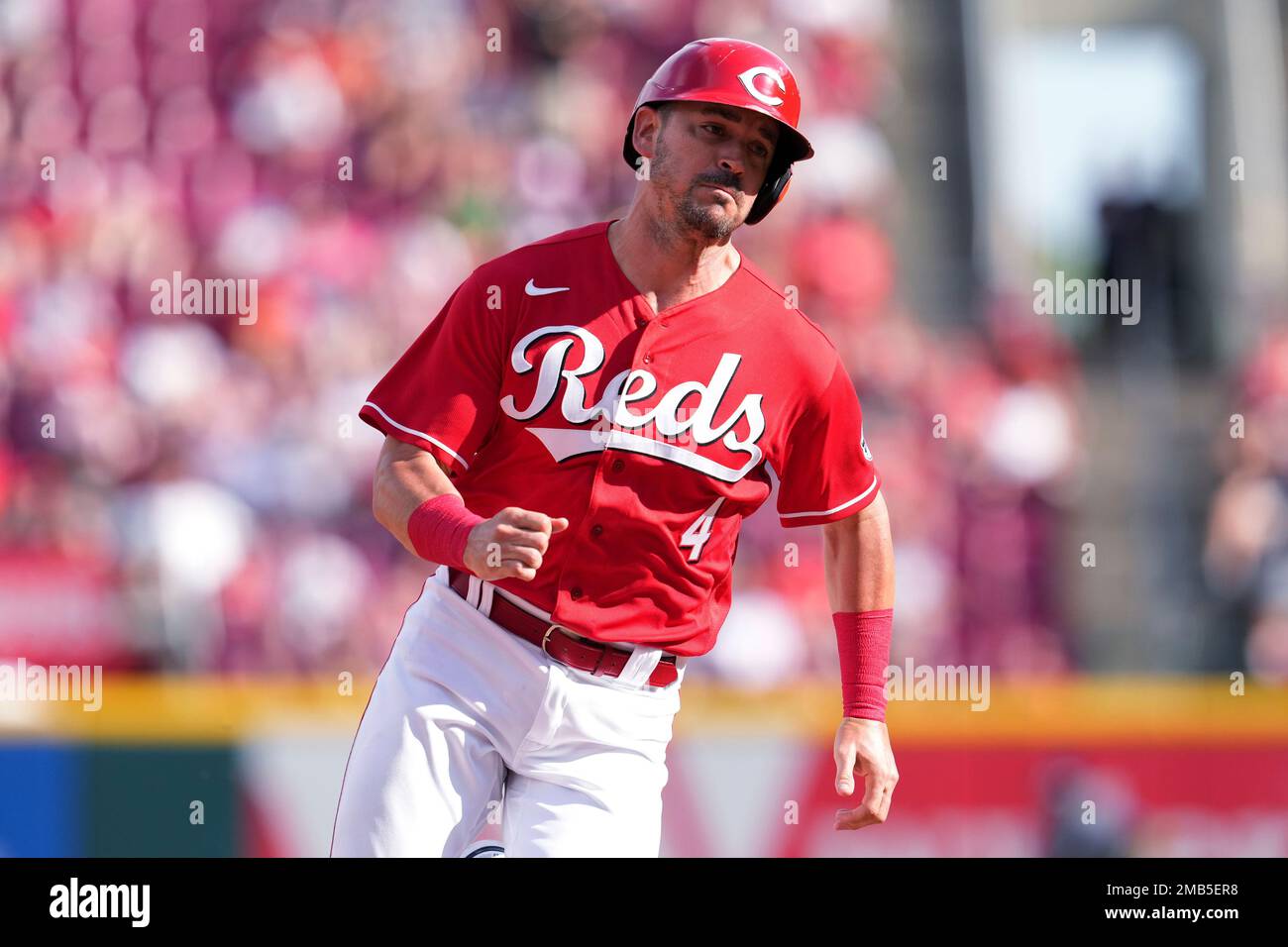 Cincinnati Reds pinch-runner Matt Reynolds rounds third base before ...