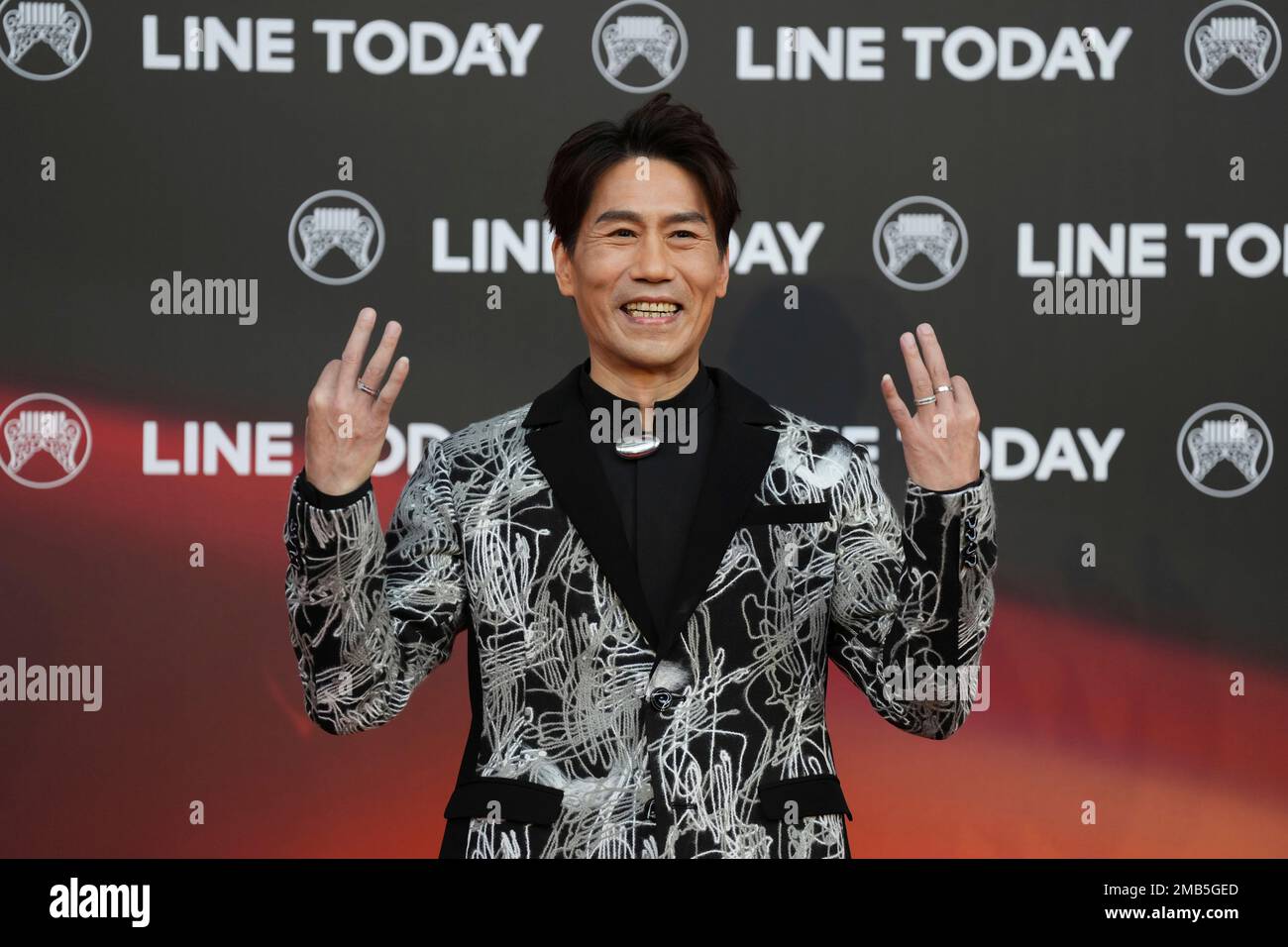 Taiwanese singer Daniel Lo poses for a photo as he arrives for the 33rd ...