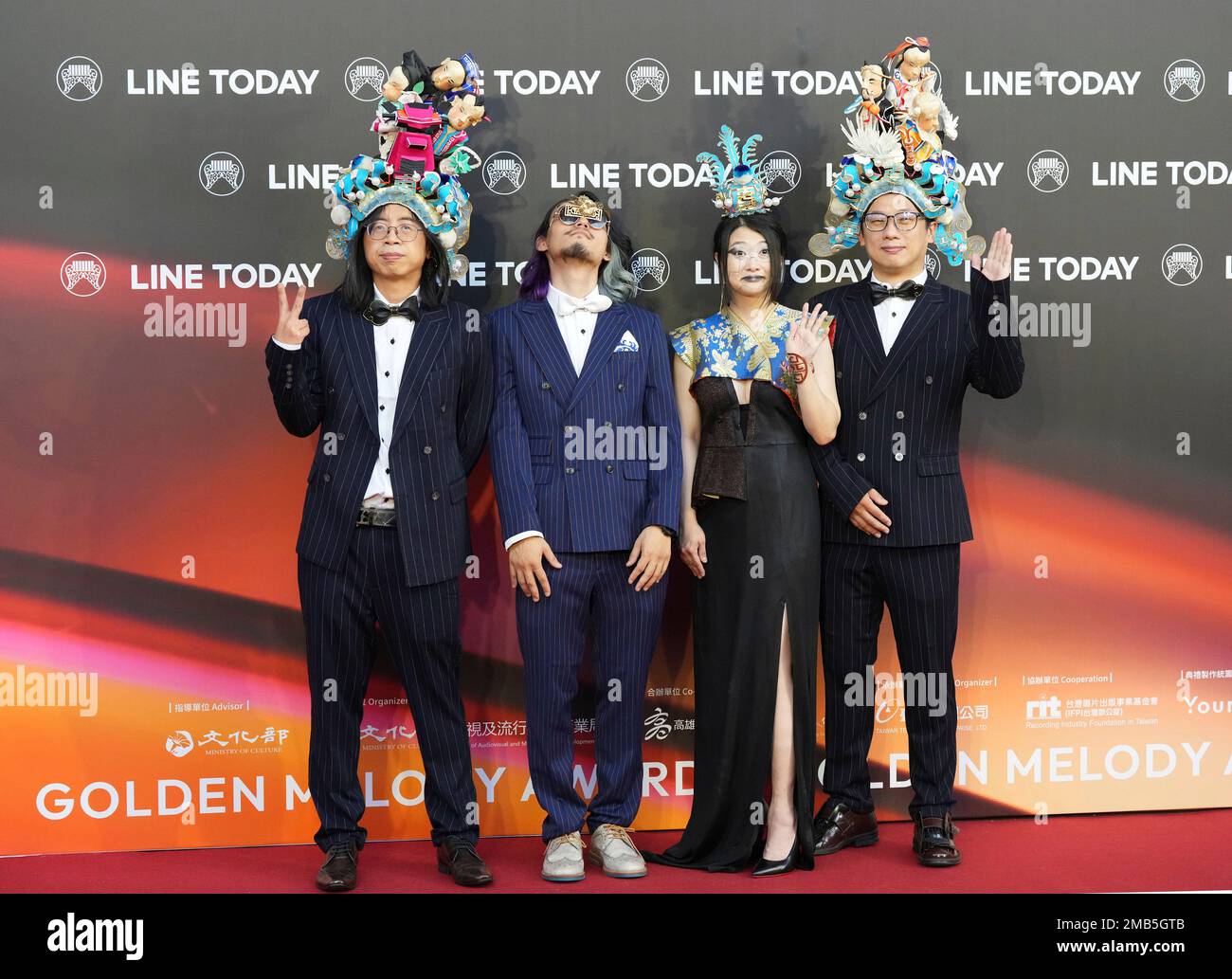 Taiwanese vocal group Sam-seng-hian-ge pose for a photo as they arrive ...