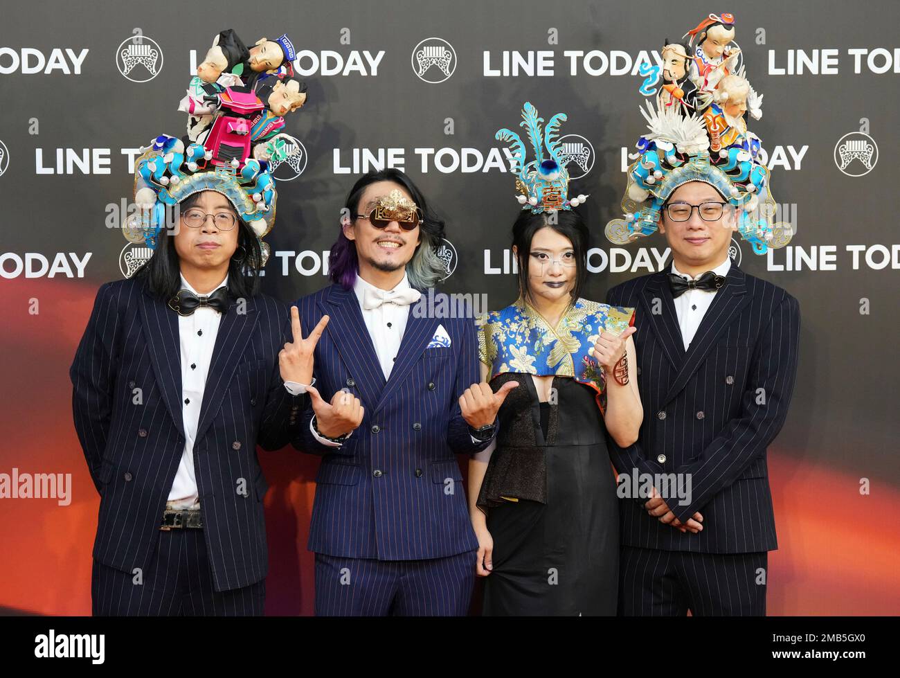 Taiwanese vocal group Sam-seng-hian-ge pose for a photo as they arrive ...