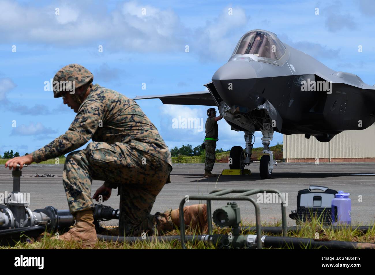 A U.S. Airman assigned to the 354th Air Expeditionary Wing and Marine ...