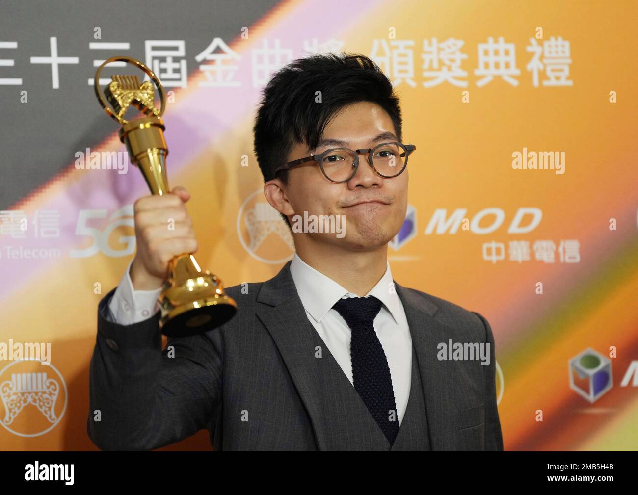 Hong Kong Album Producer Alan Kwan holds his award for Best ...