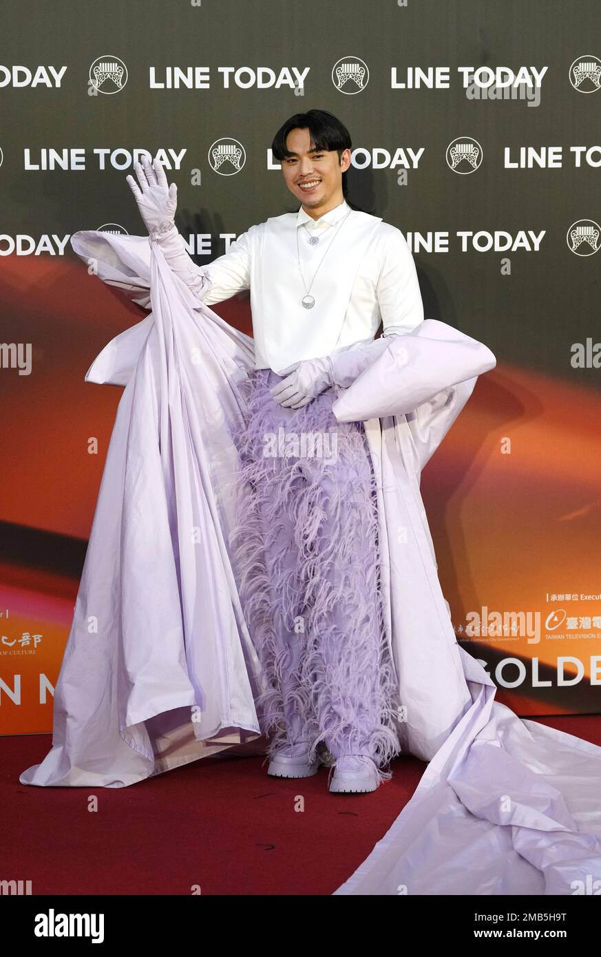 Taiwanese composer HUSH poses for a photo as he arrives for the 33rd ...