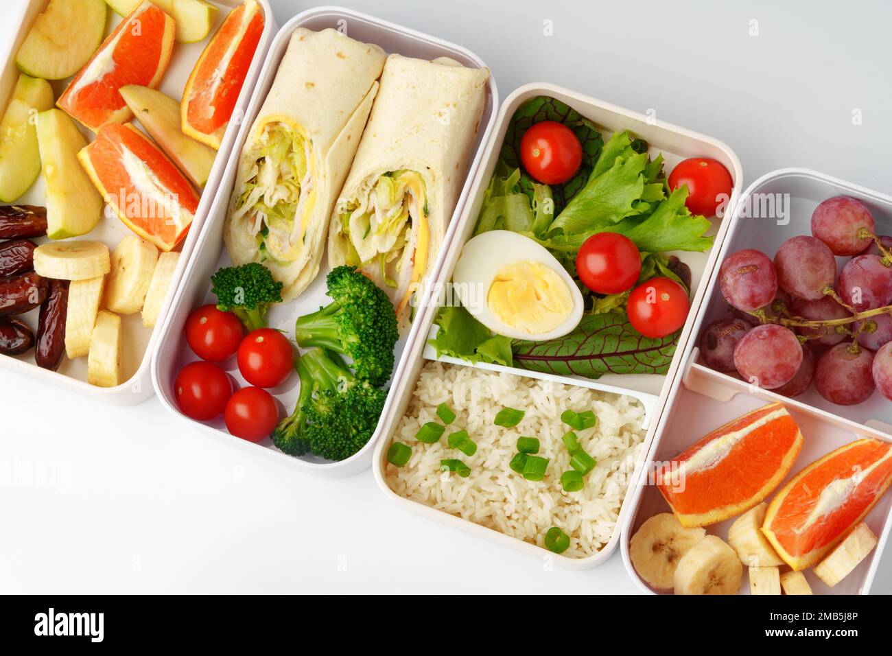 Lunch boxes with healthy food isolated on white Stock Photo - Alamy
