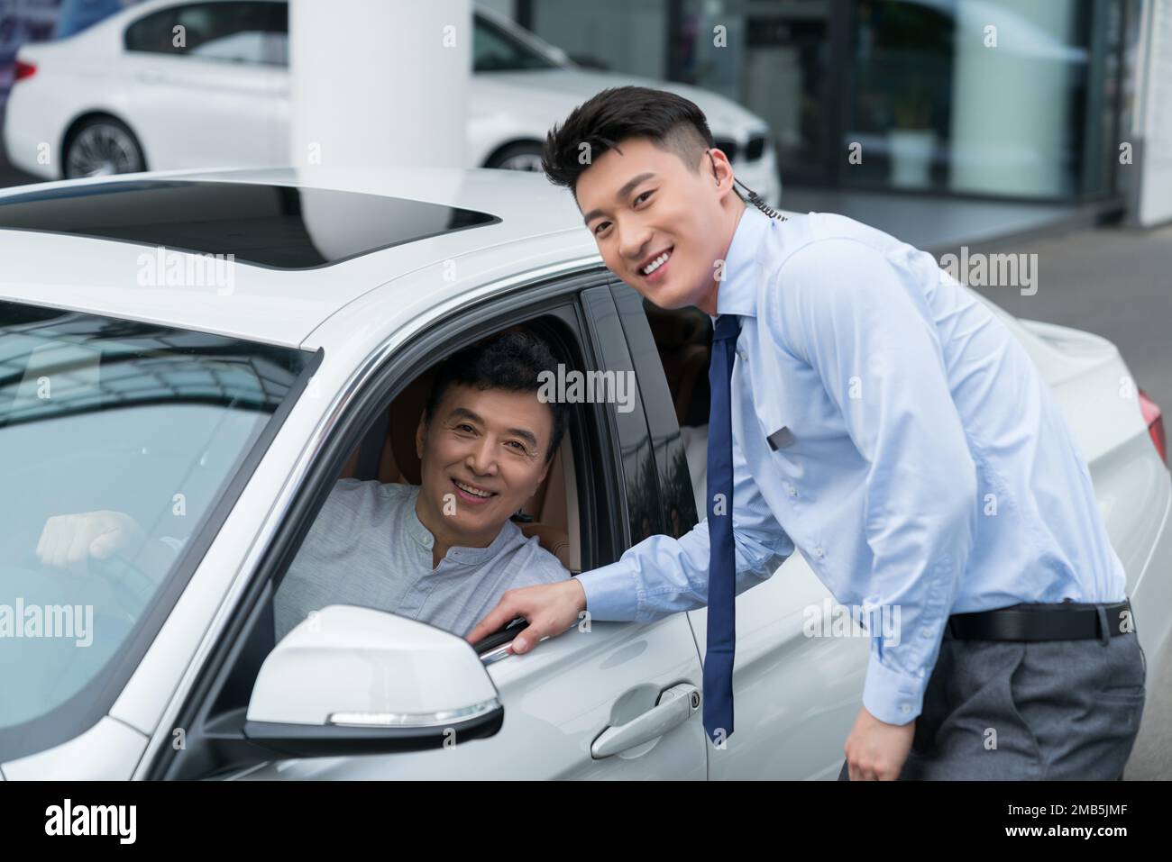 The old man test drive car Stock Photo - Alamy