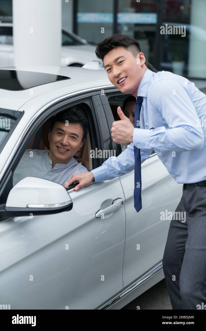 The old man test drive car Stock Photo - Alamy