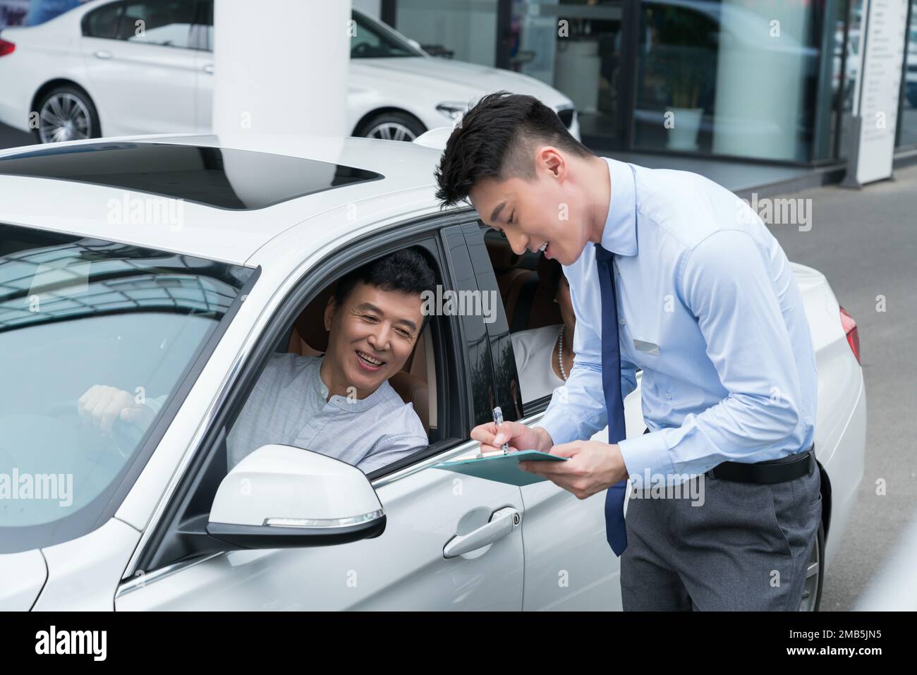 The old man test drive car Stock Photo - Alamy