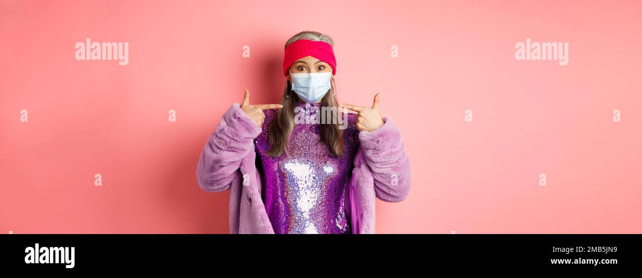 Covid-19, social distancing and fashion concept. Asian edlerly woman in ...