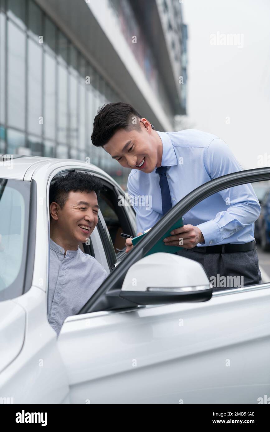 The old man test drive car Stock Photo - Alamy