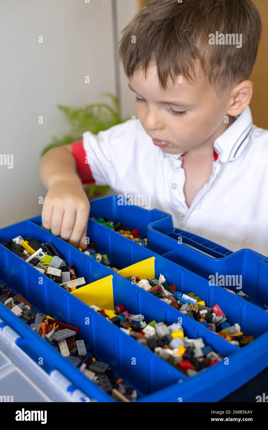 Khabarovsk, Russia, August 02, 2022. Cut child male sorting heap of ...
