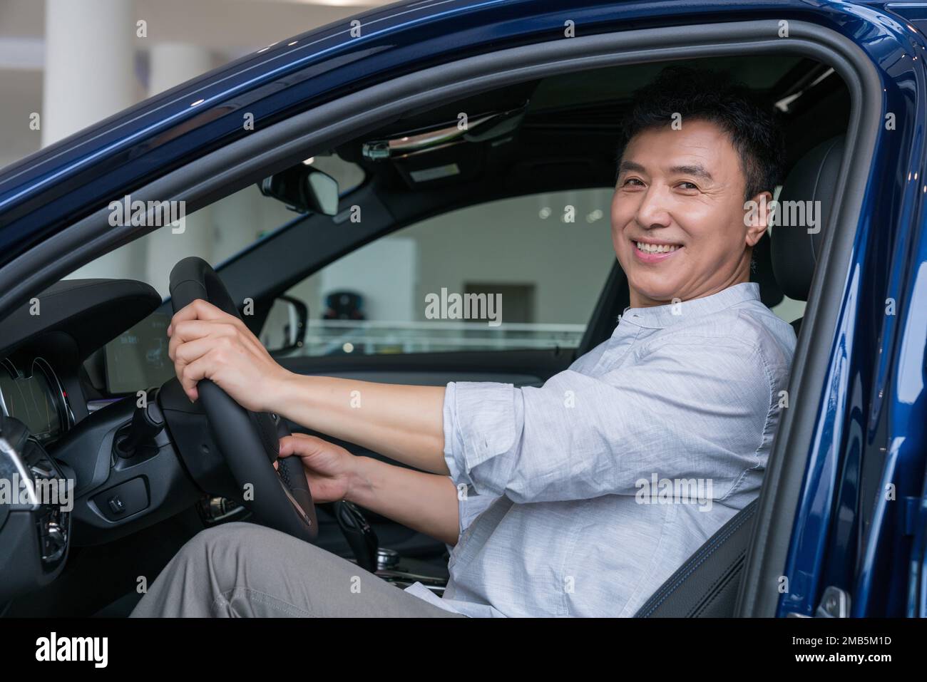The old man test drive car Stock Photo - Alamy