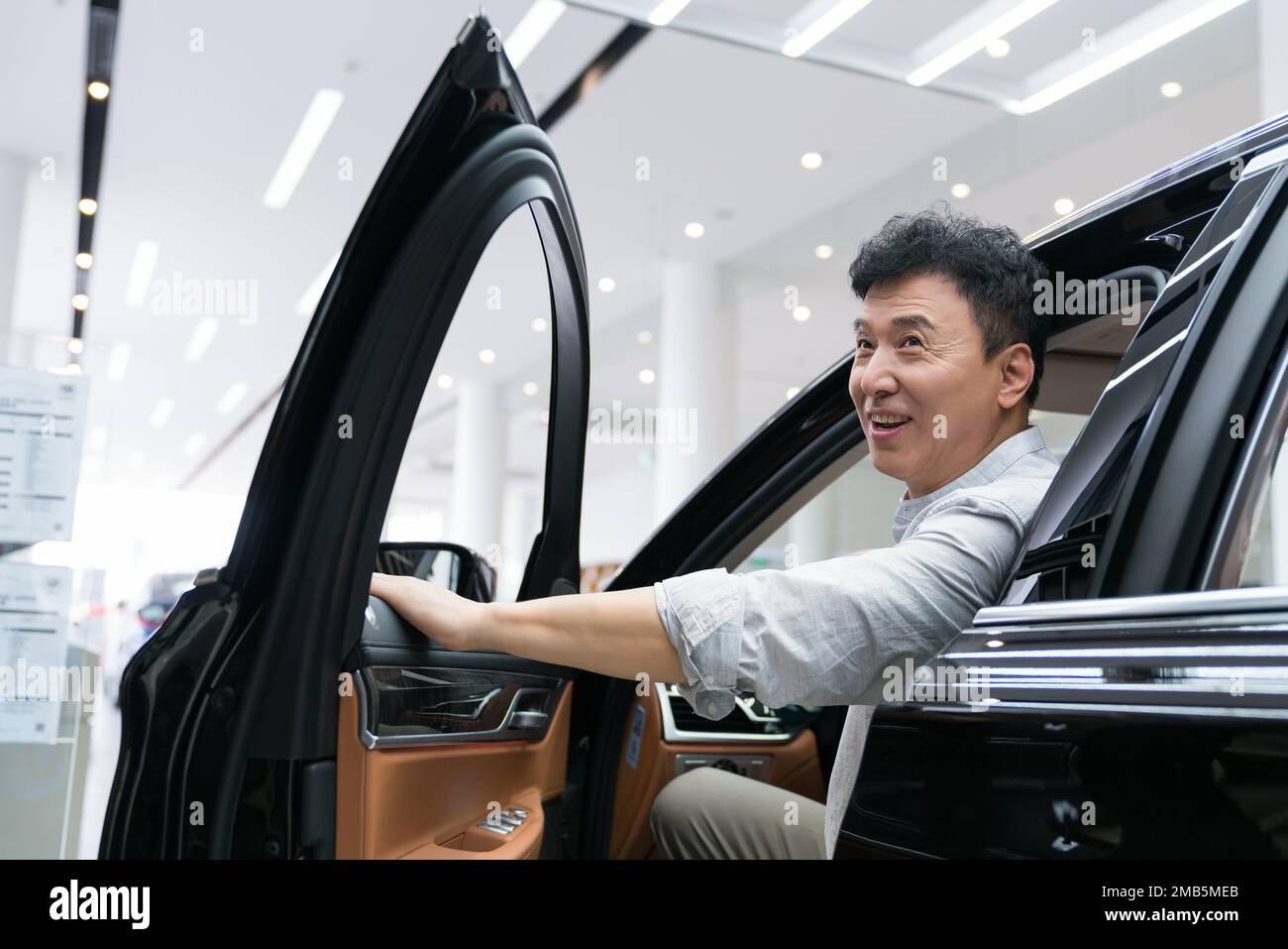 The old man test drive car Stock Photo - Alamy