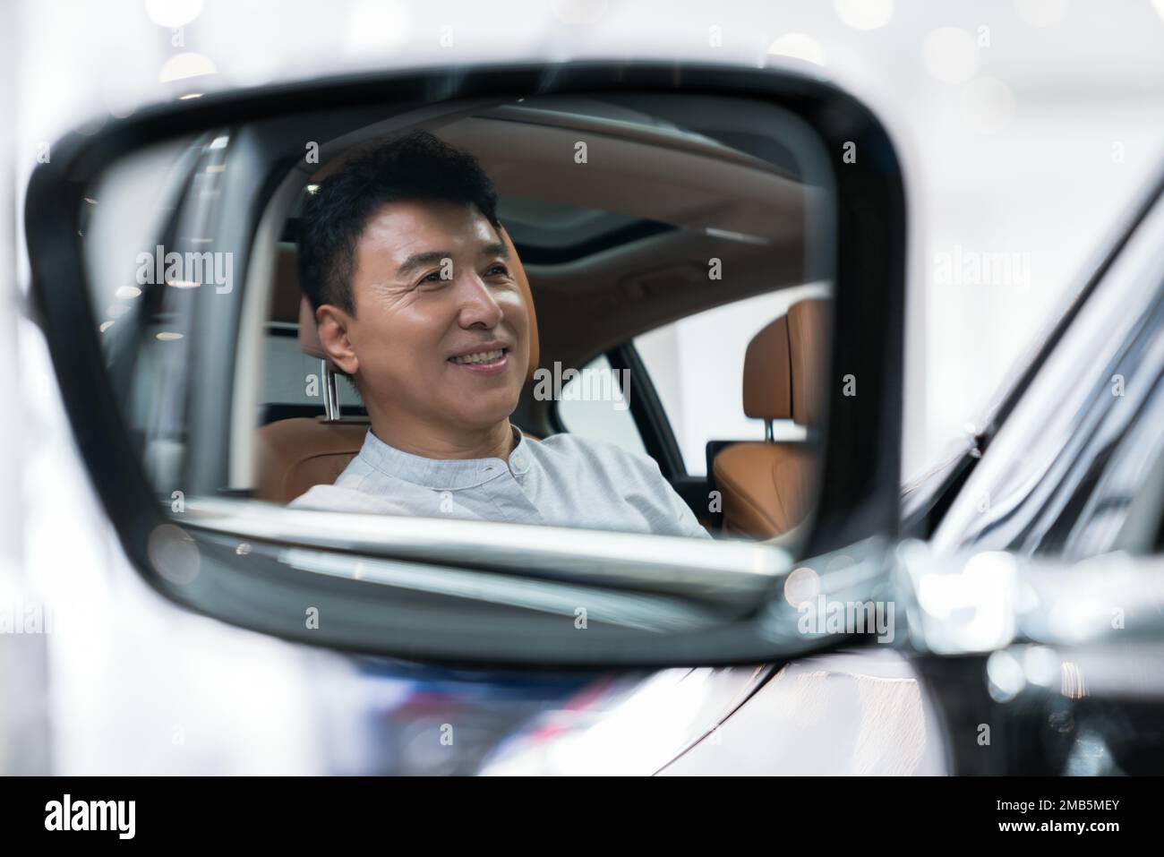 The old man test drive car Stock Photo - Alamy