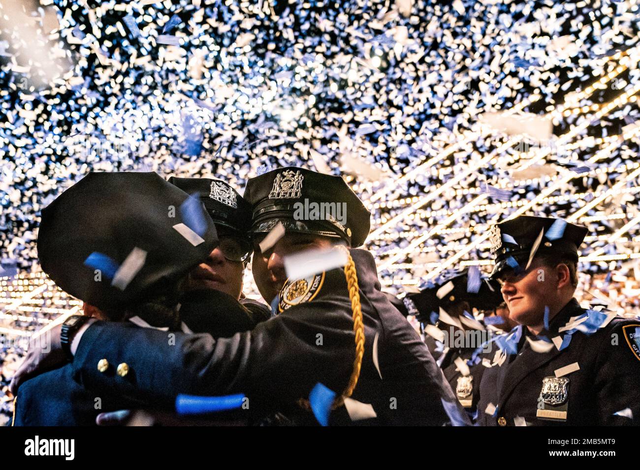 New York City Police Academy graduates celebrate under confetti at the ...