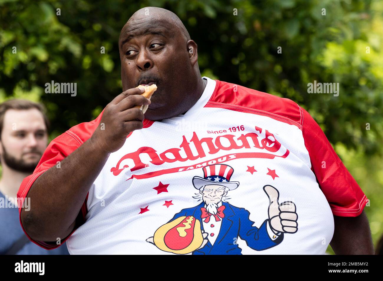 Competitive eater Eric "Badlands" Booker speaks at a weigh-in before the Nathan's Famous July ...