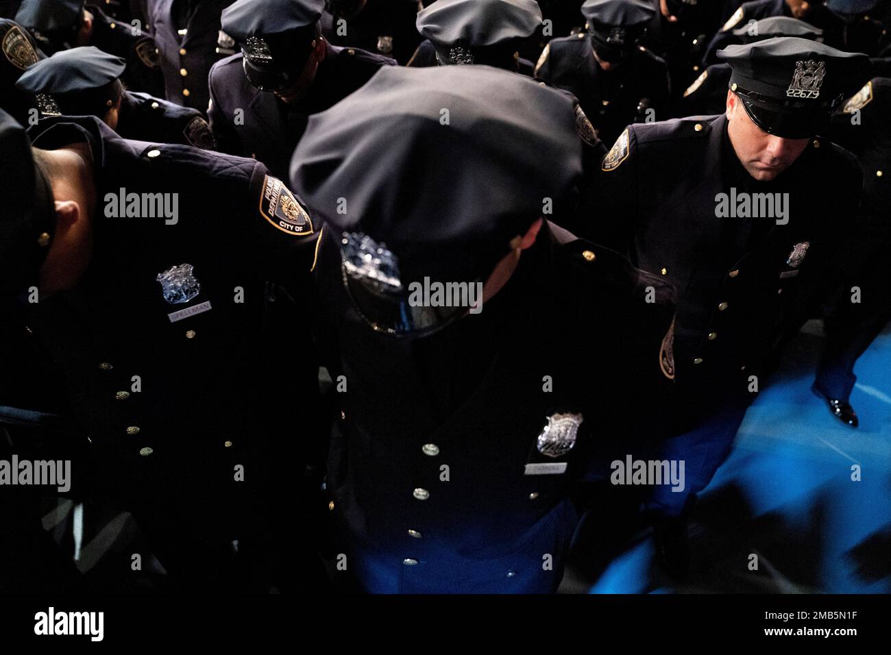 New York City Police Academy graduates bow their heads for a ...