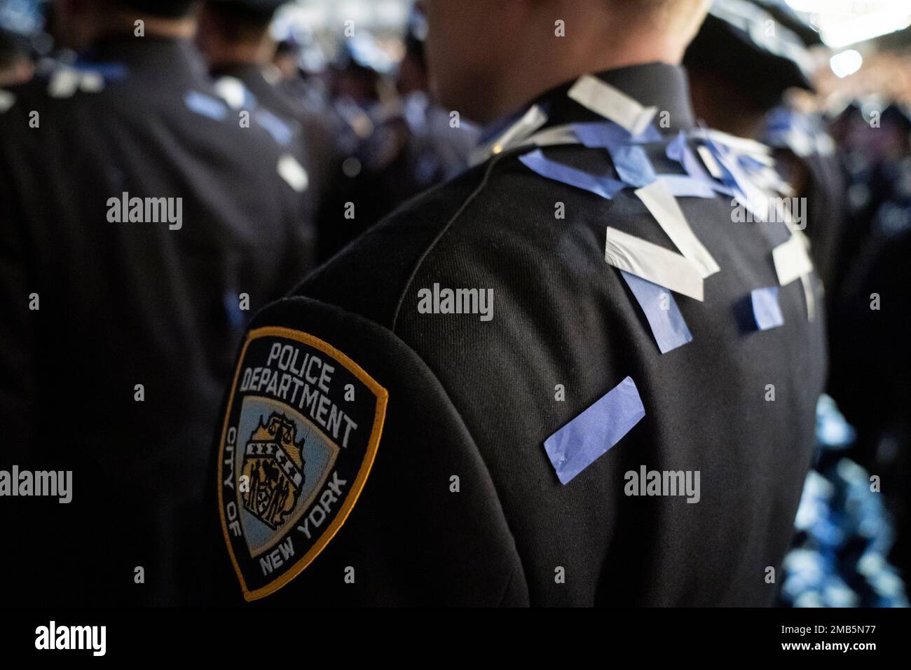 Confetti rests on the shoulders of a New York City Police Academy ...