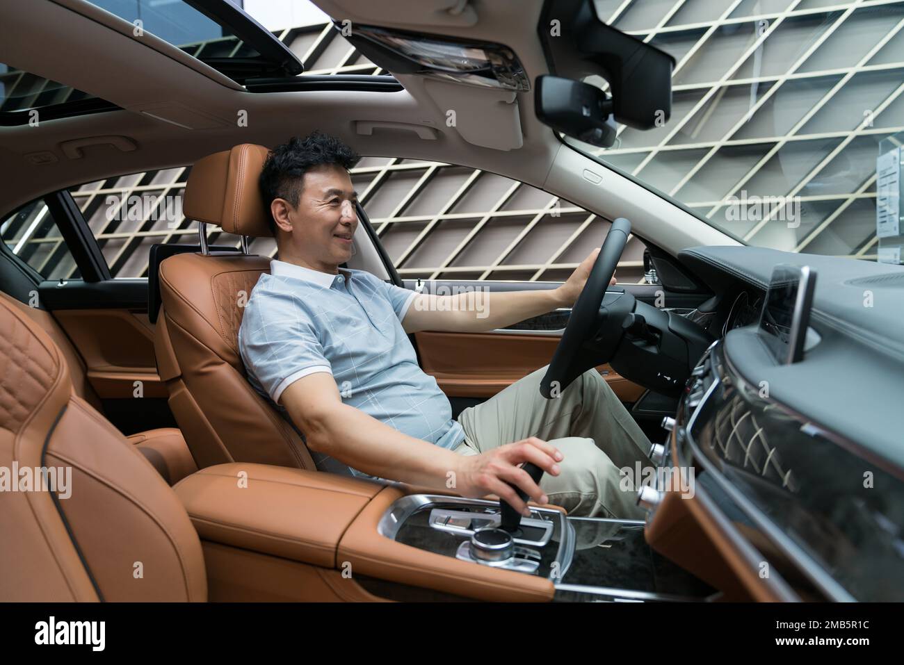 The old man test drive car Stock Photo - Alamy