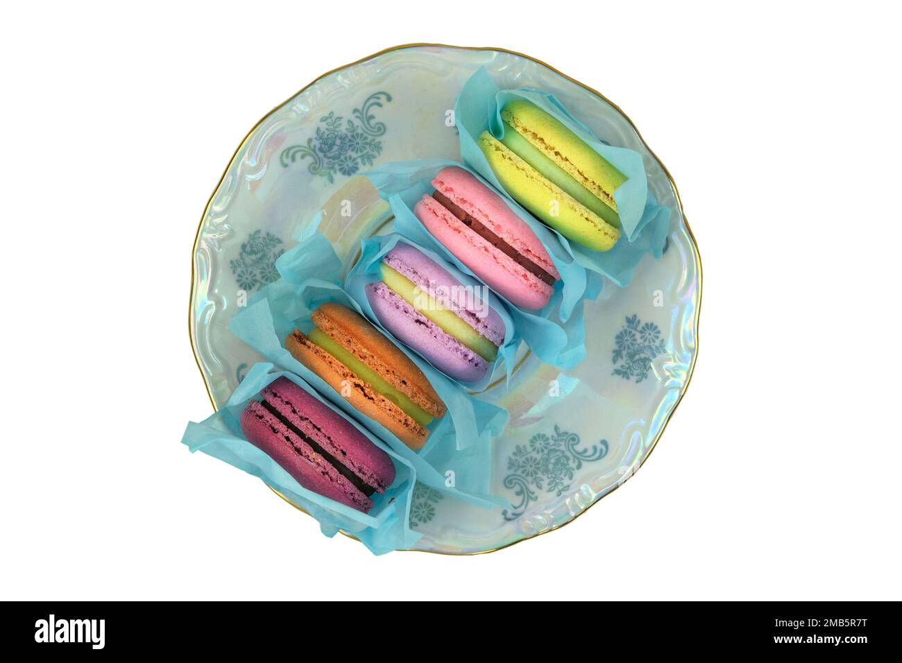 Sweet desserts in plate for the holiday. Macaroons isolated on white ...