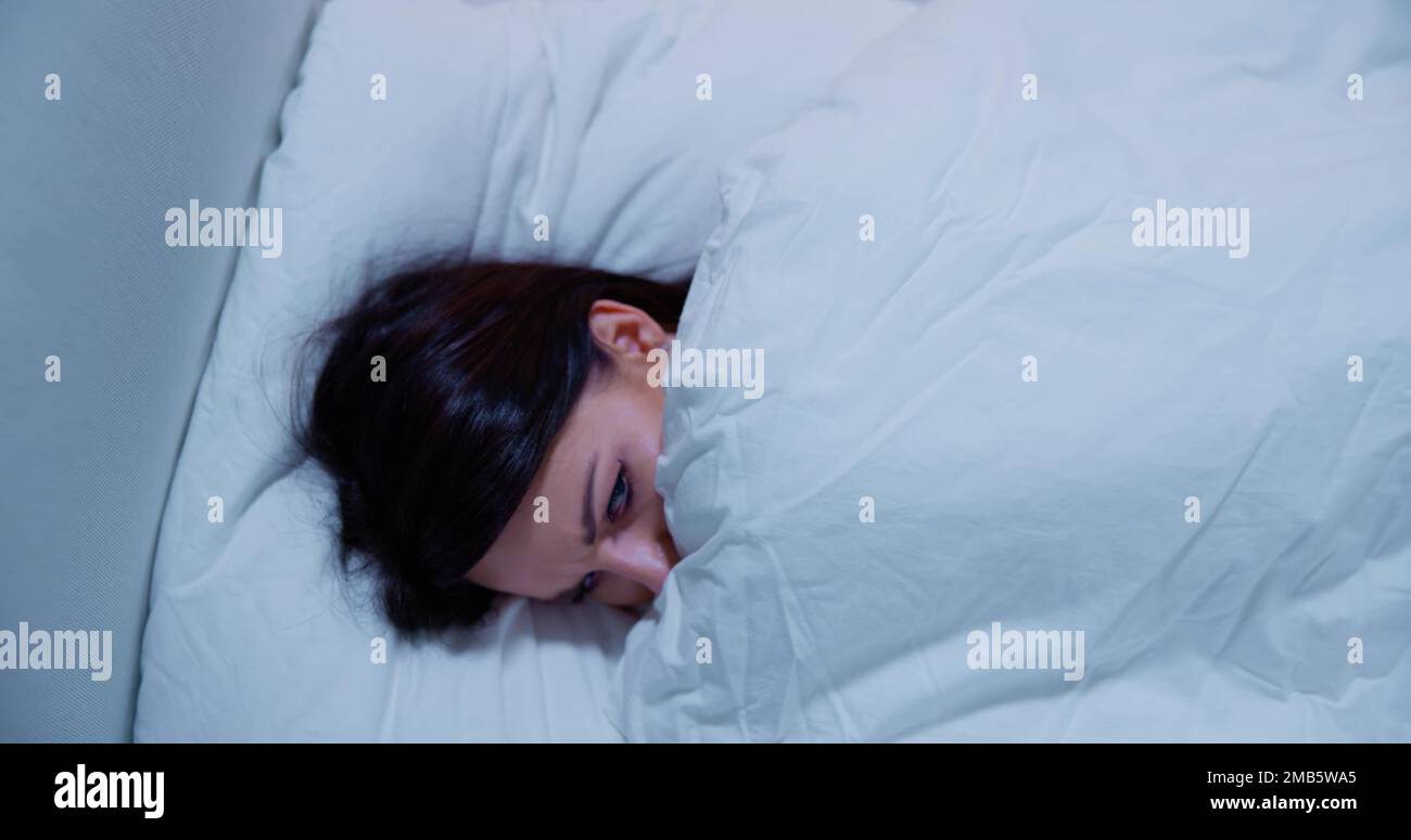 Awake Sleepless Woman Afraid And Scared At Night Stock Photo - Alamy
