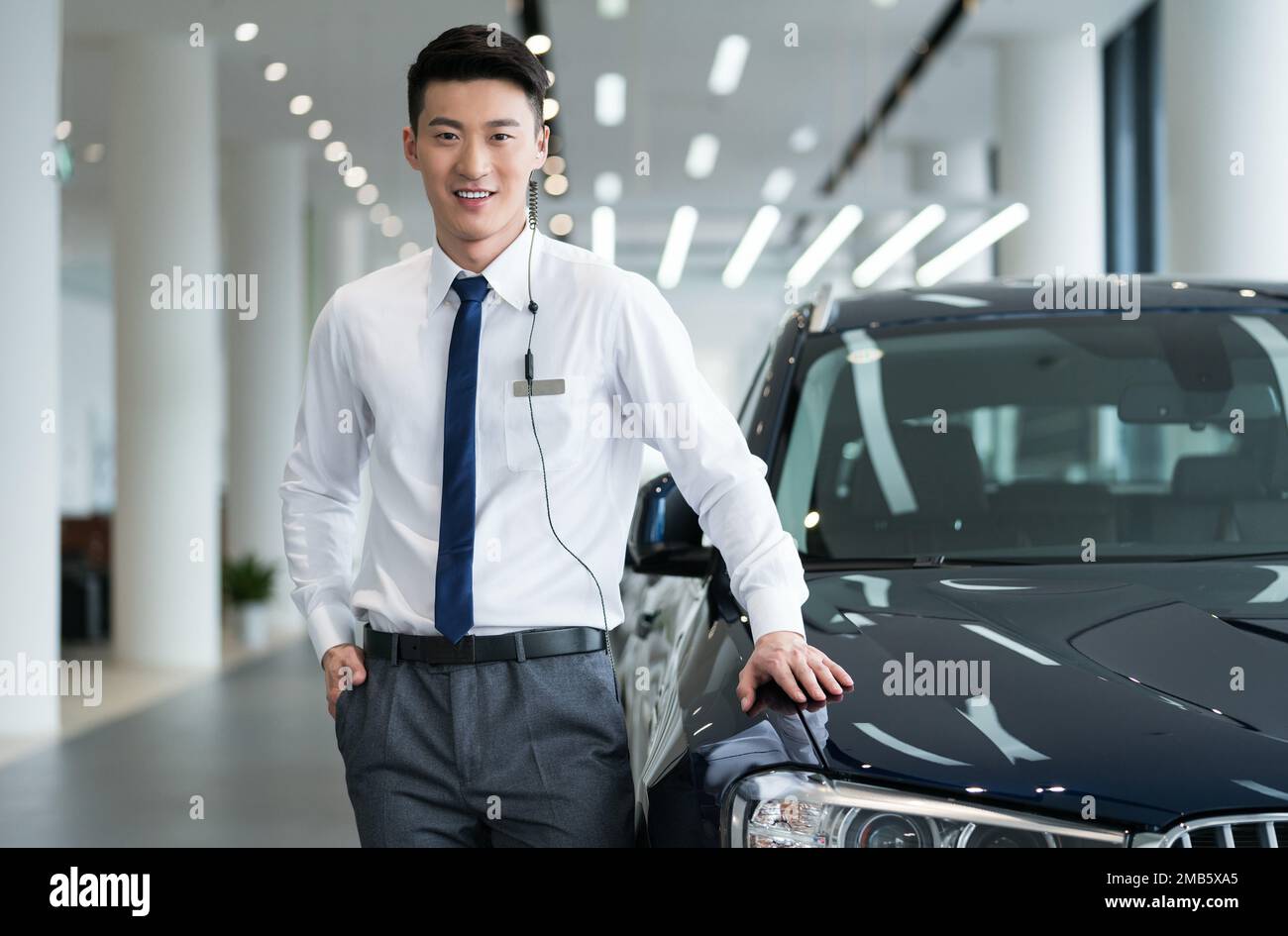 Man in shop wearing suit hi-res stock photography and images - Alamy