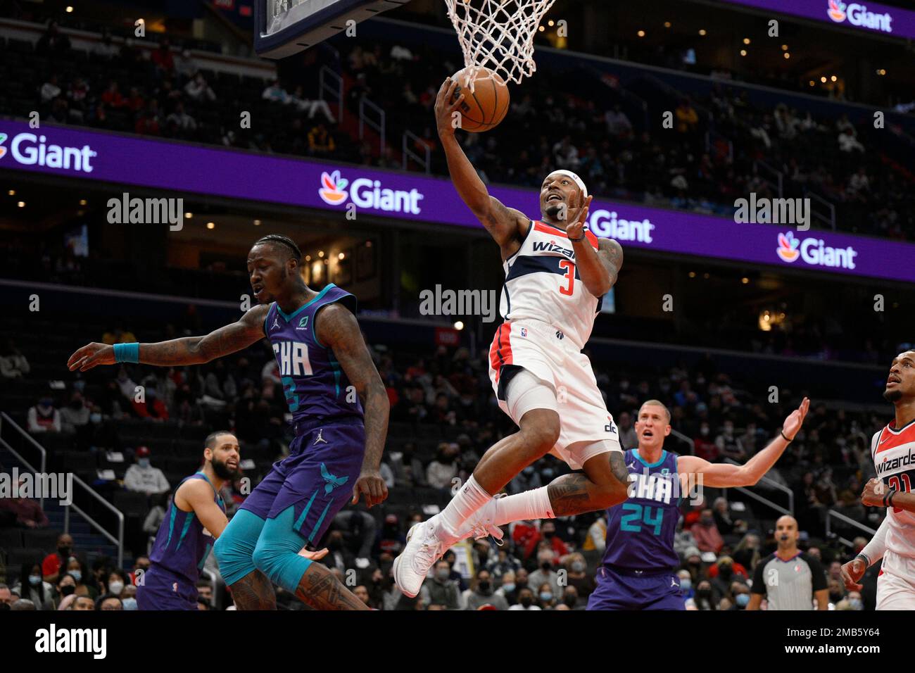 FILE - Washington Wizards guard Bradley Beal, center, goes to the basket against Charlotte ...