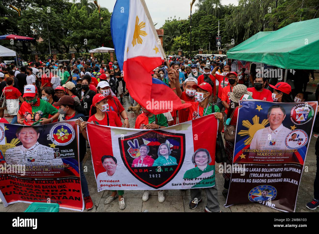 Suppoerters of President-elect Ferdinand Marcos Jr. carry signs and ...
