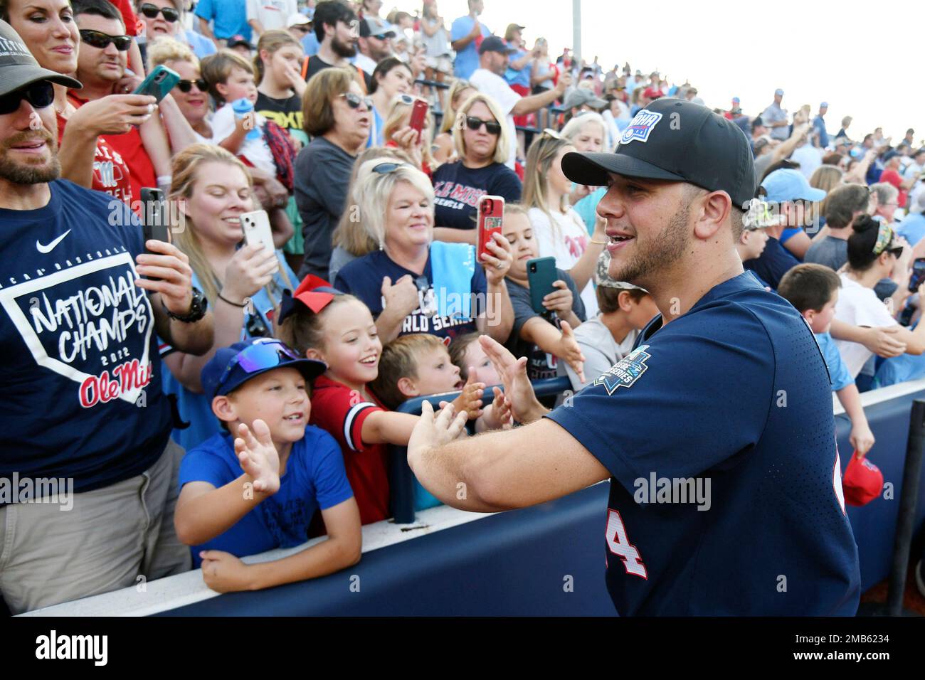 Mississippi pitcher Dylan DeLucia greet fans as the Mississippi ...